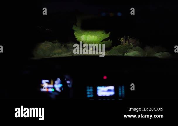 At night view from car moving in city with blurred lights. Defocused ...