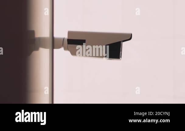 On white background security camera moving recording outside. CCTV ...