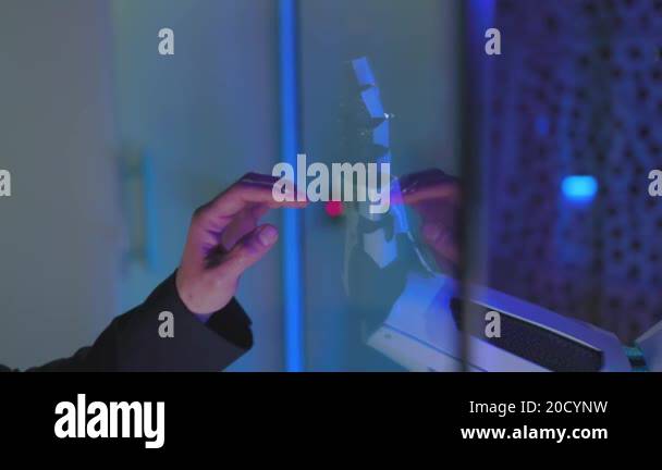 Close up hands businessman touch hands with a cybernetic robot through ...