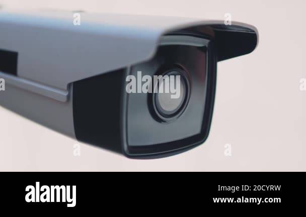 Security camera moving recording outside a building. CCTV surveillance ...