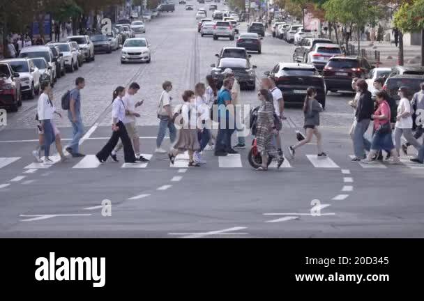 KYIV, UKRAINE OCTOBER 21, 2024 : Crowd of people on a crosswalk, slow ...