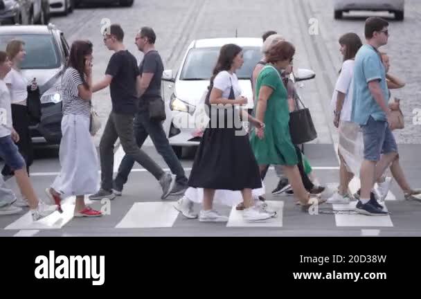 KYIV, UKRAINE OCTOBER 21, 2024 : Crowd of people on a crosswalk, slow ...
