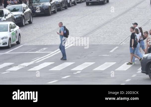 KYIV, UKRAINE OCTOBER 21, 2024 : Crowd of people on a crosswalk, slow ...