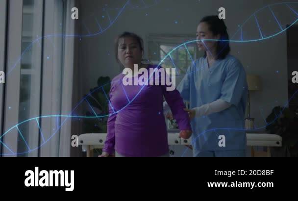 Animation of dna strands over asian female nurse treating female ...