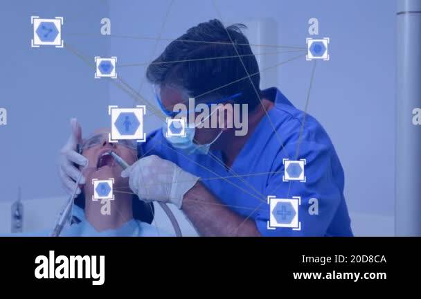 Dentist treating patient with dental tools, medical icons and network ...