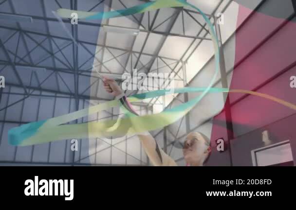 Gymnast performing with ribbon, colorful swirling animation over indoor ...