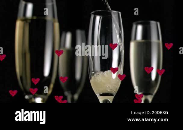 Pouring champagne into glasses with red hearts animation for ...
