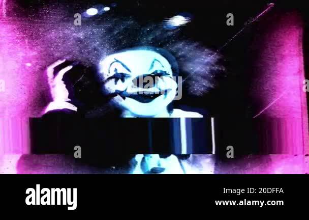 Creepy spooky clown with dust and scratches on tv scrren glitch effect ...