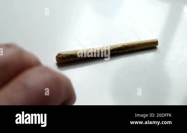 Fingers tapping nervously next to cannabis joint Stock Video Footage ...