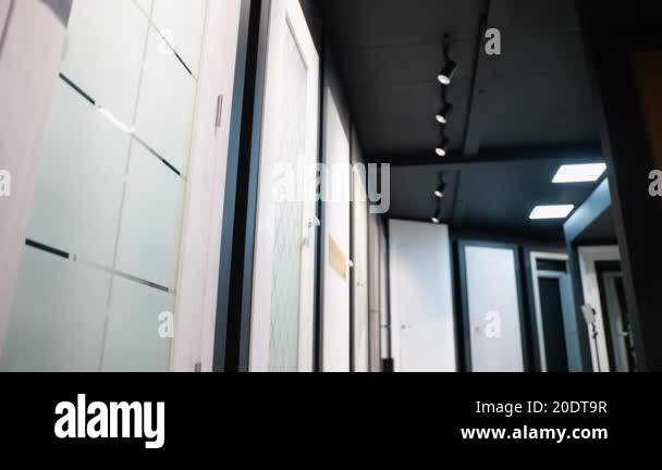 Modern showroom displaying a variety of interior and entry doors ...