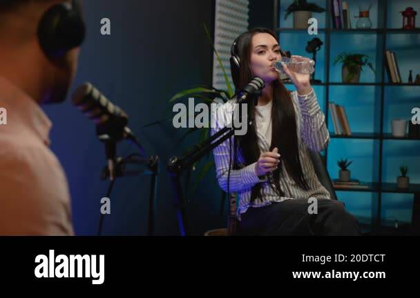 A podcast guest passionately shares their thoughts during a recording ...