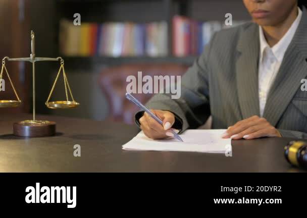 Close up of Female Judge Writing Verdict in Office Stock Video Footage ...
