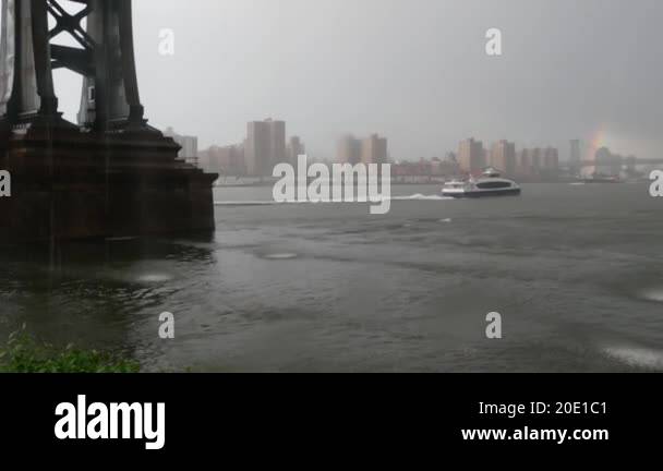 Rainy New York City under Manhattan Bridge in Brooklyn. Rainbow from ...