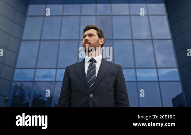 Professional manager posing outside glass building closeup. Portrait of ...