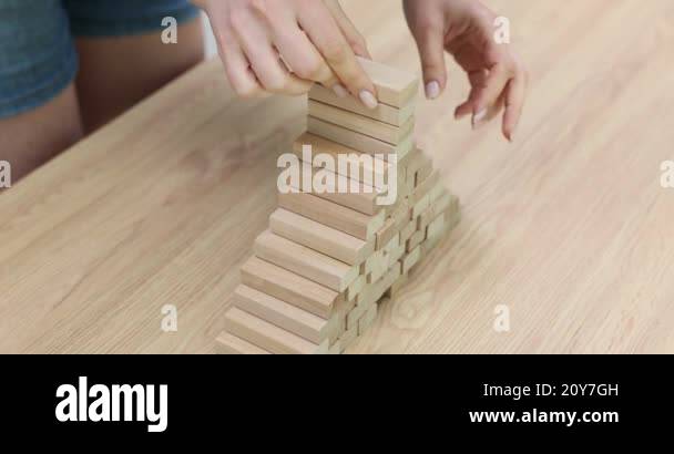 Stacking wooden blocks to create a pyramid structure. Business growth ...