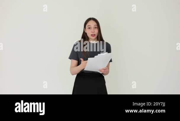 Young woman explaining details of documents or young actress rehearsing ...