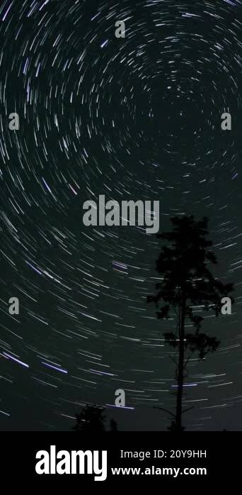 Time lapse of Star trails in the night sky. Stars move around a polar ...