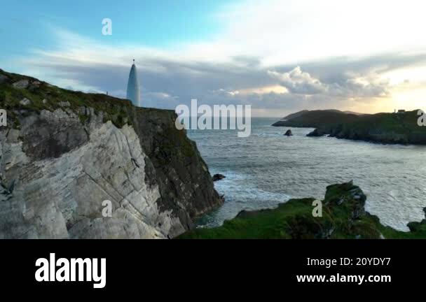 Aerial 4k. The Baltimore Beacon on the sunset in South West Cork ...