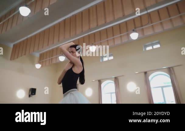 Circular. A professional ballerina moves beautifully in the center of ...