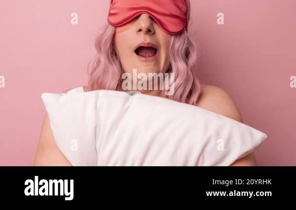 Sleeping 20s 30s woman in home wear having fun while resting wear sleep mask yawns as wants to ...