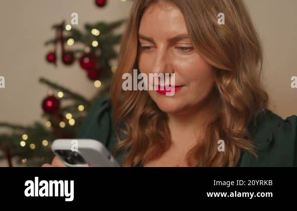 Joyful europian woman used mobile cell phone look overhead sitting in ...