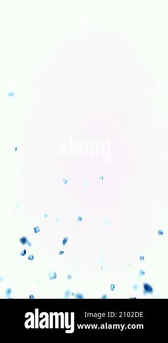 Vibrant blue sprinkles floating gracefully against a clean white ...