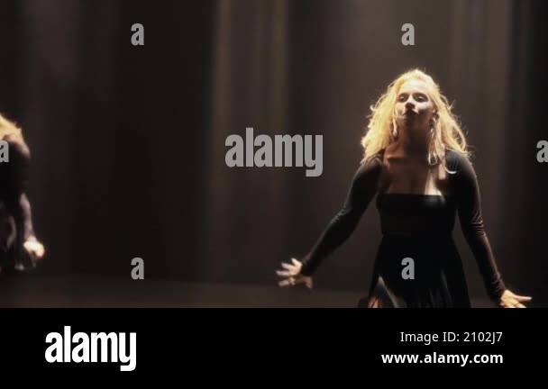 A young dancer showcases her talent under bright studio lights ...