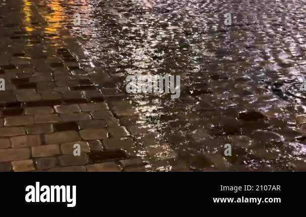 Puddles, streams of water, reflection of light from electric lamps ...