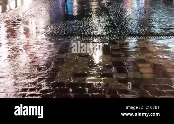 Puddles, streams of water, reflection of light from electric lamps ...