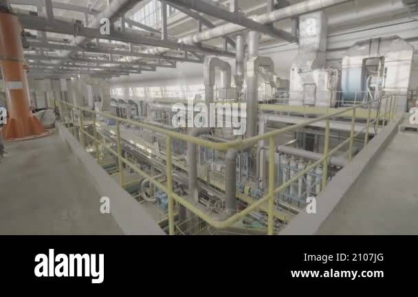 Huge multi-level cardboard factory with tiers and large equipment ...