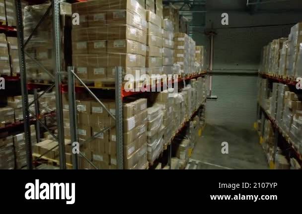 High shelf with finished products in large company warehouse. Stacks of ...