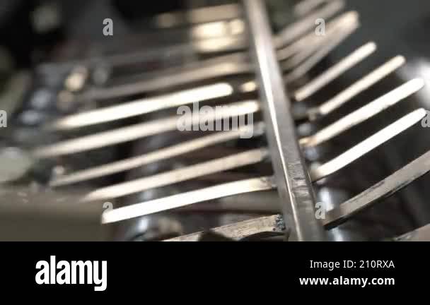 Raw materials in form of waste paper move along conveyor. Paper bales ...