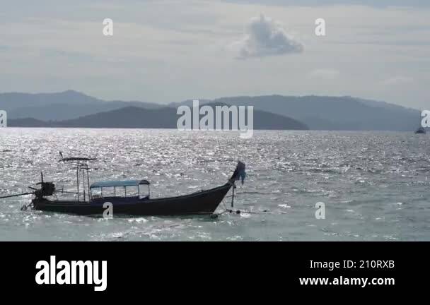 Traveling vintage Asian speed boat is parked and flowing on the ocean ...