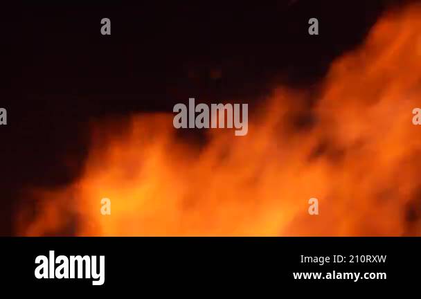 the fire blazes on, casting a mesmerizing glow and radiating intense ...