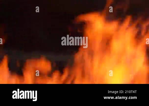 the fire blazes on, casting a mesmerizing glow and radiating intense ...