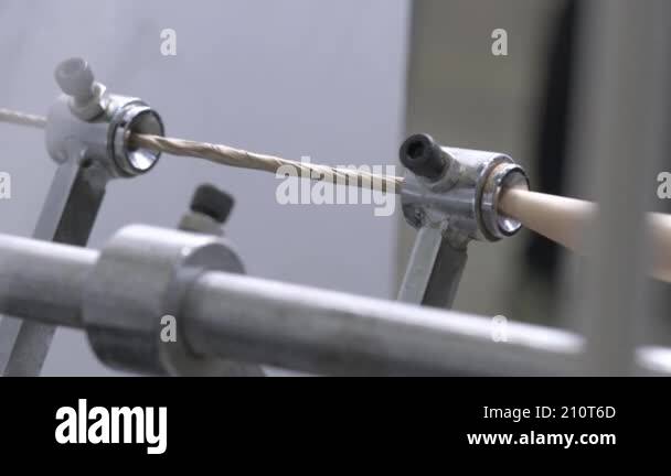 Small cylinders form shape of moving cardboard material. Cardboard ...