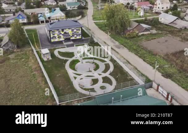 Vivid design of village Hall catches eye among greenery aerial view ...