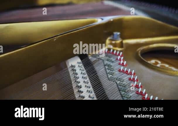 Open grand piano unveils inner strings and detailed structure closeup ...