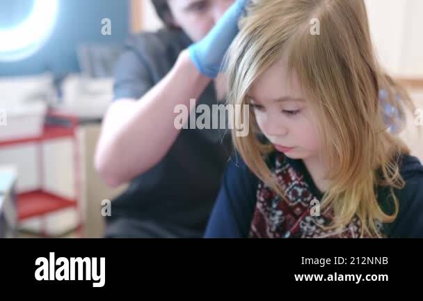 Portrait of cute little girl during appointment of dermatologist in ...
