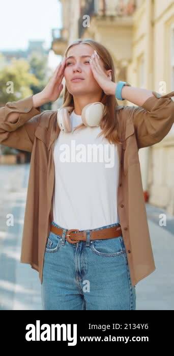 Displeased exhausted Caucasian woman rubbing temples to cure headache ...