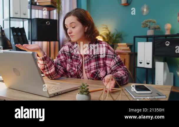 I dont know what to say. Confused businesswoman working on laptop at ...