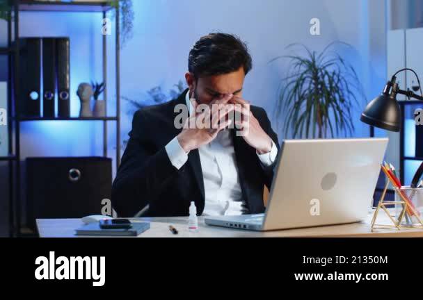 Sick Indian businessman freelancer suffering from eyes strain fatigue ...