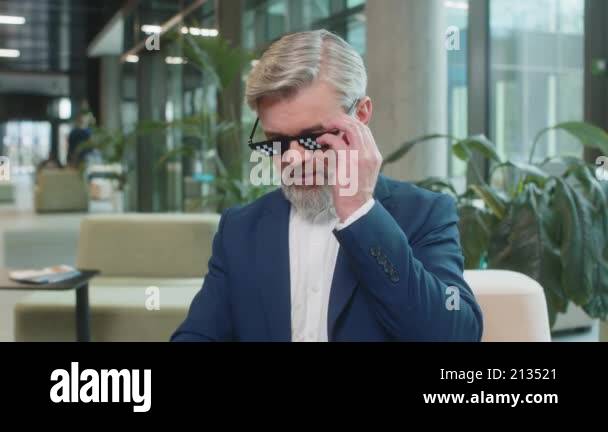 Happy rich Caucasian mature businessman putting on thug life sunglasses ...