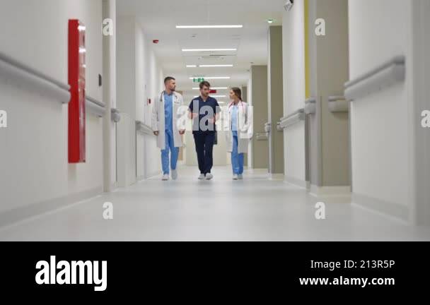 Three healthcare professionals, including two doctors and a nurse ...
