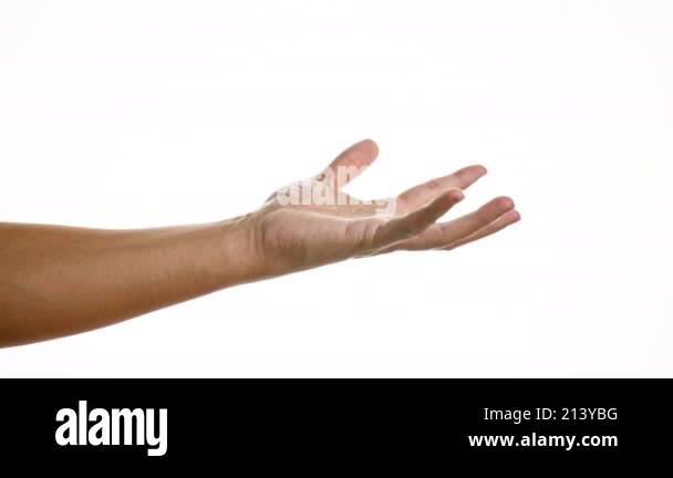 Man's hand with fingers extended, isolated over a white background wall ...