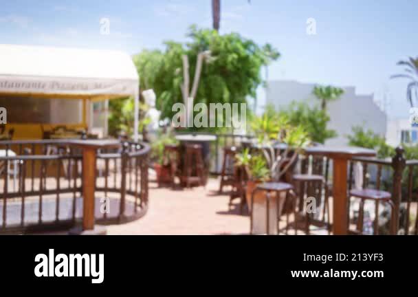 Outdoor blurred scene of a restaurant terrace in lanzarote with empty ...