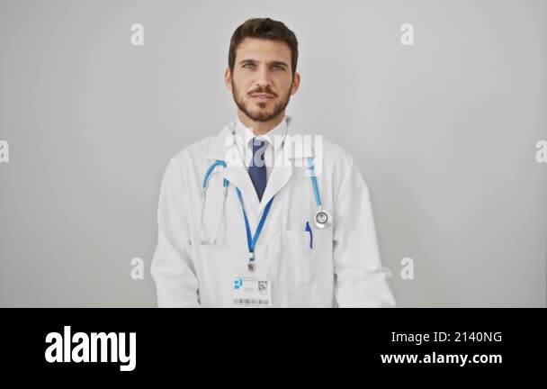 Victorious young hispanic man winking and flashing v-sign with fingers ...