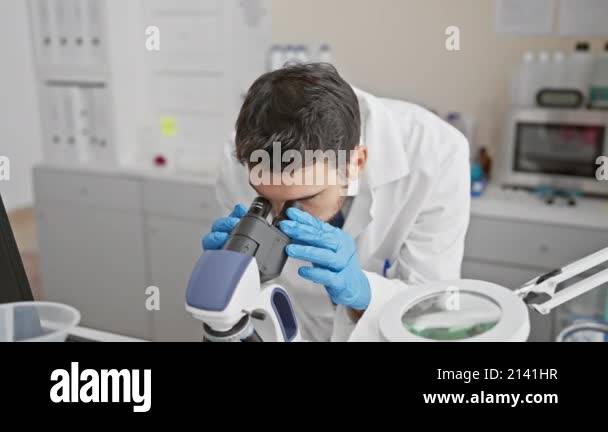Scientist man using microscope in Stock Videos & Footage - HD and 4K ...