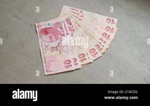 Turkish banknotes, featuring 10 turkish lira bills, are neatly spread ...