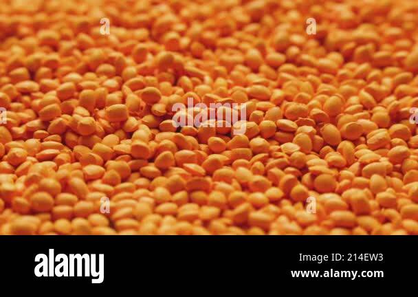 Orange polymer dye in granules, background texture Stock Video Footage ...